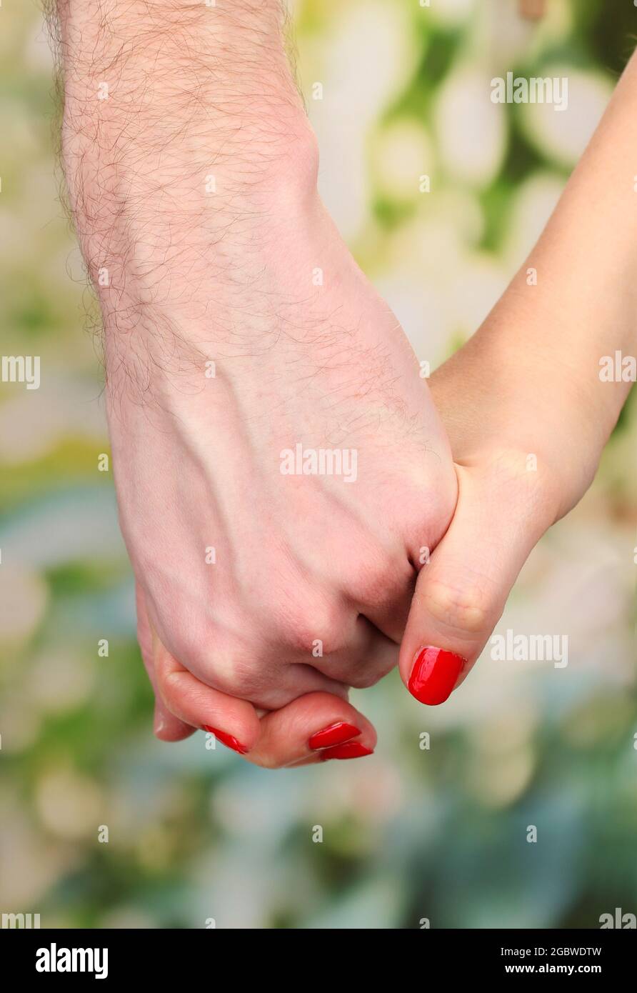 Two hands over green nature park Stock Photo - Alamy