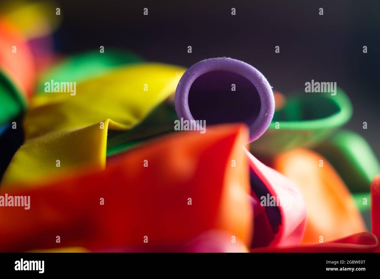 Closeup of a stack of colorful balloons Stock Photo - Alamy