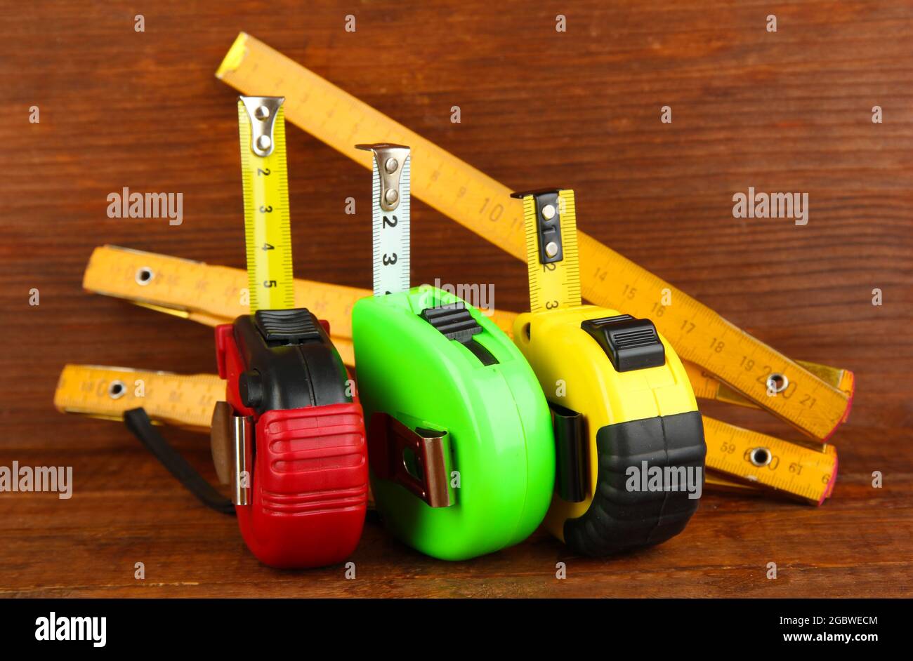 Tape measure and ruler on wooden background Stock Photo - Alamy