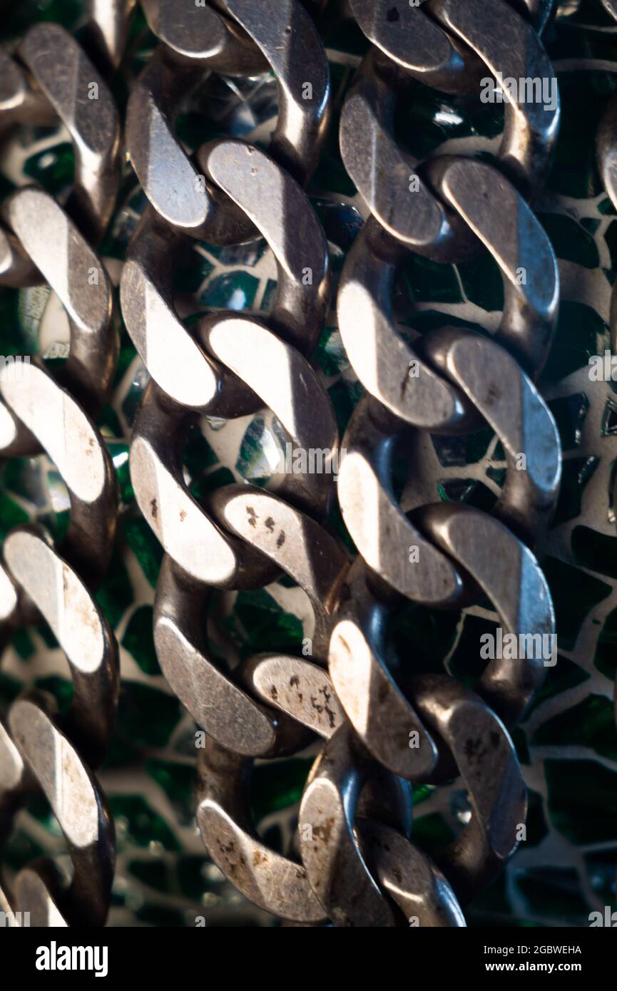 Vertical closeup of a silver chain details Stock Photo - Alamy