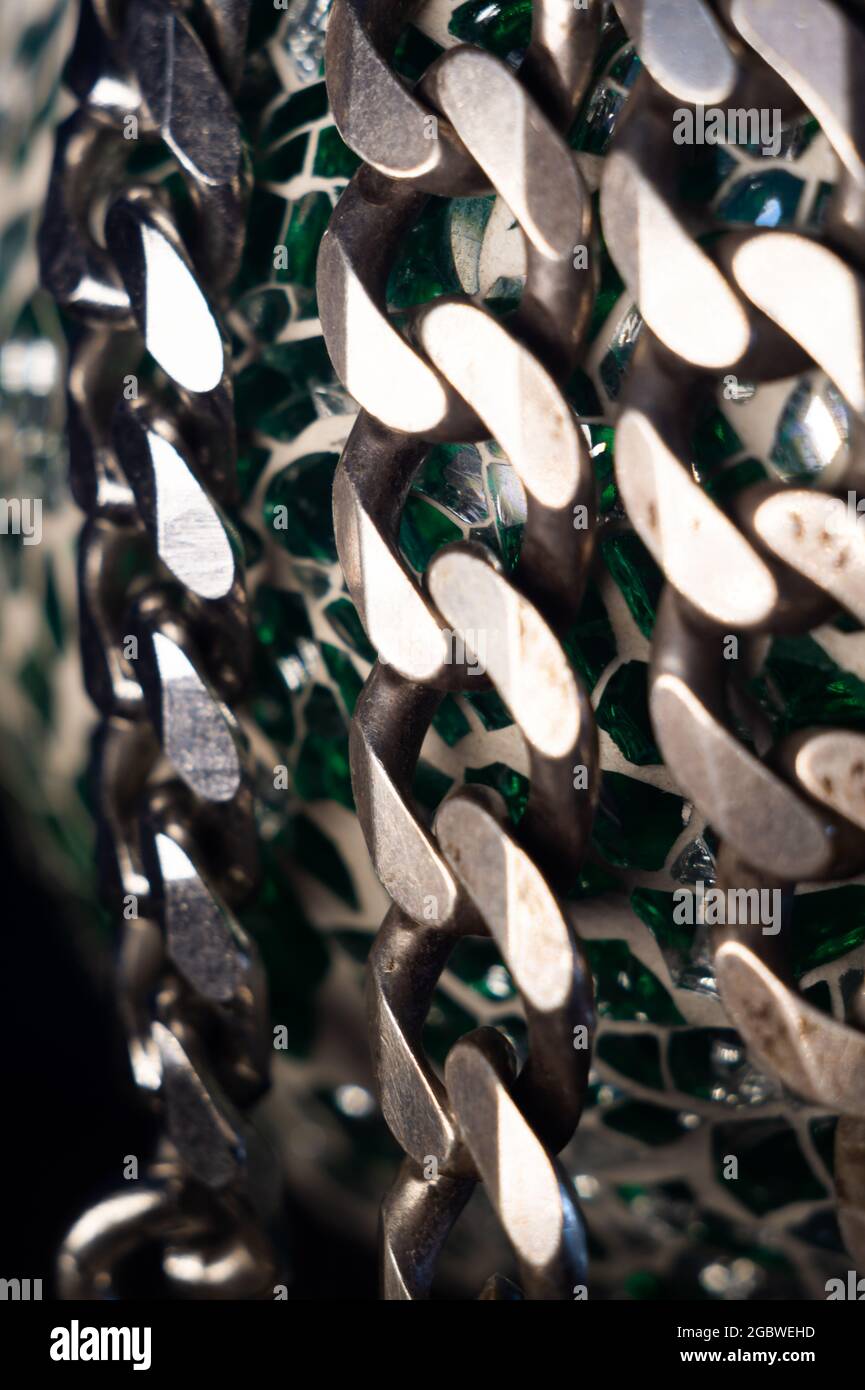 Vertical closeup of a silver chain details Stock Photo - Alamy