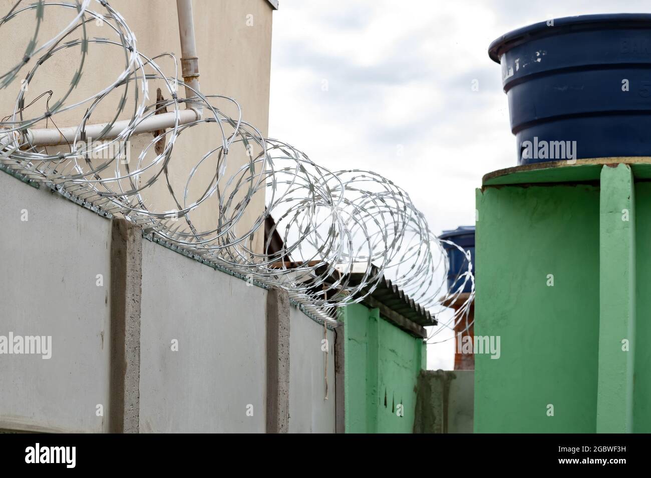 Concertina for residential protection installed in a wall Stock Photo ...