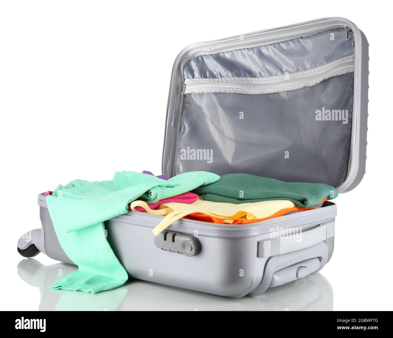 Open silver suitcase with clothing isolated on white Stock Photo - Alamy