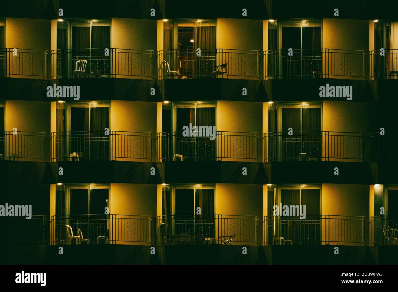 Hotel windows at night texture and background Stock Photo - Alamy