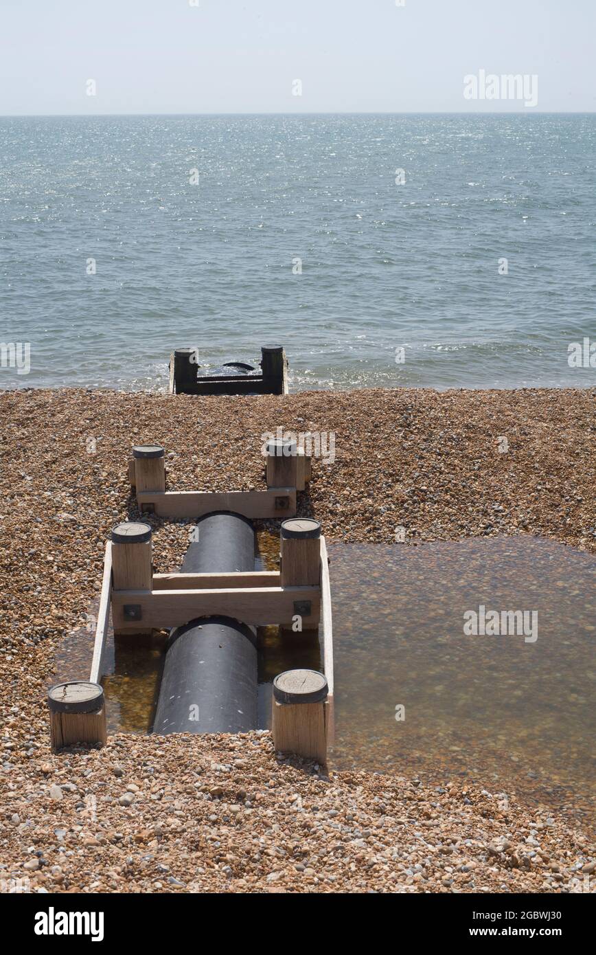 Beach drain pipe into the sea Stock Photo - Alamy