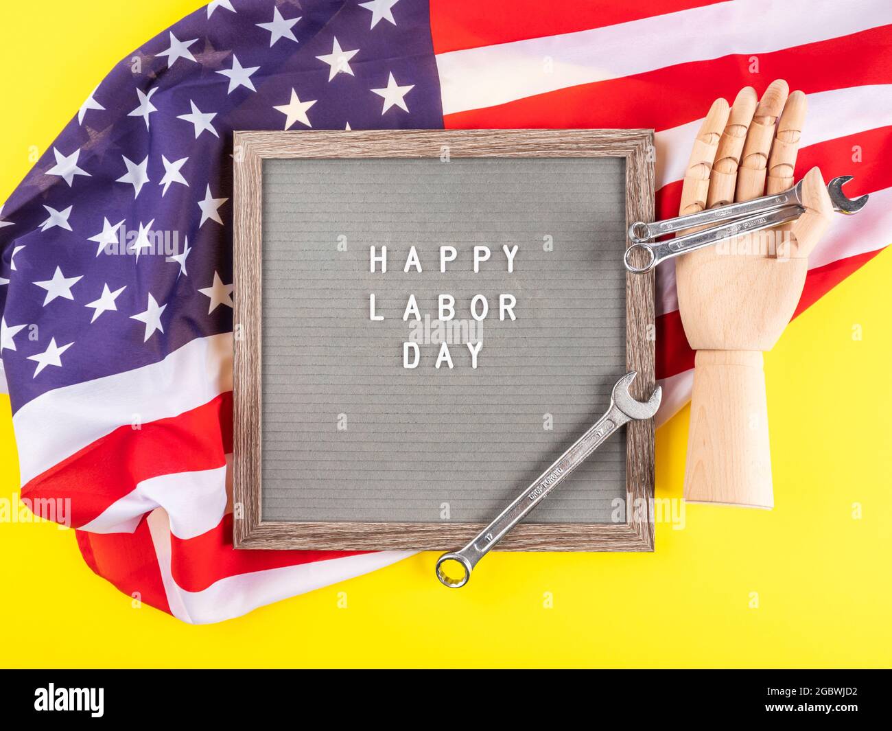 Happy Labor Day greetings on letter board with spanners, flag Stock ...