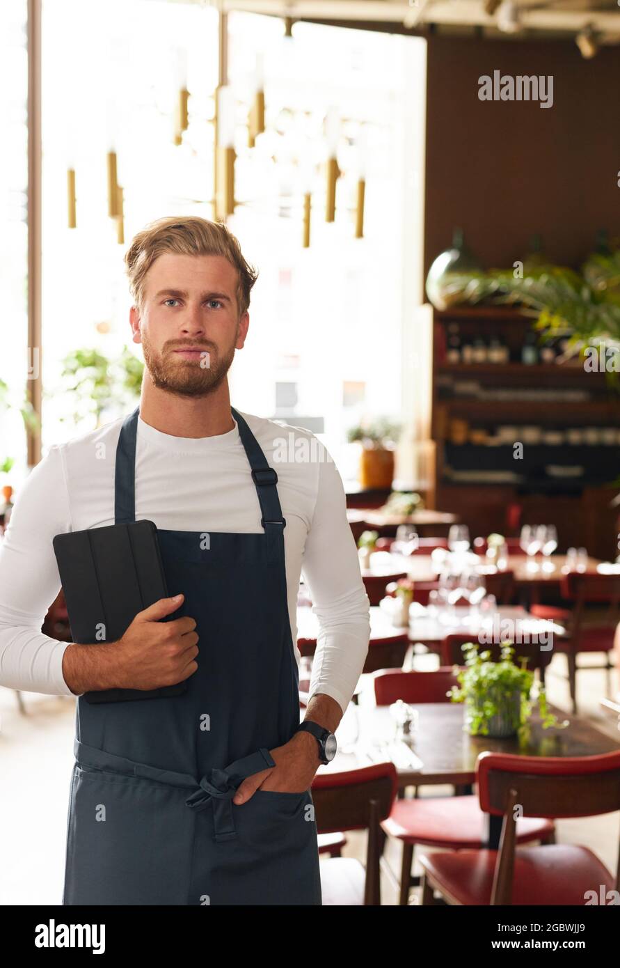 Handsome waiter restaurant interior hi-res stock photography and images ...