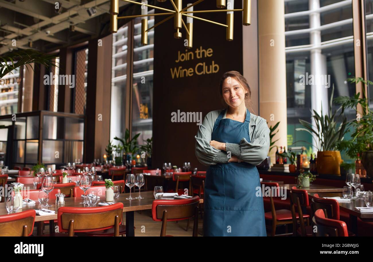 Portrait female owner arms hi-res stock photography and images - Alamy