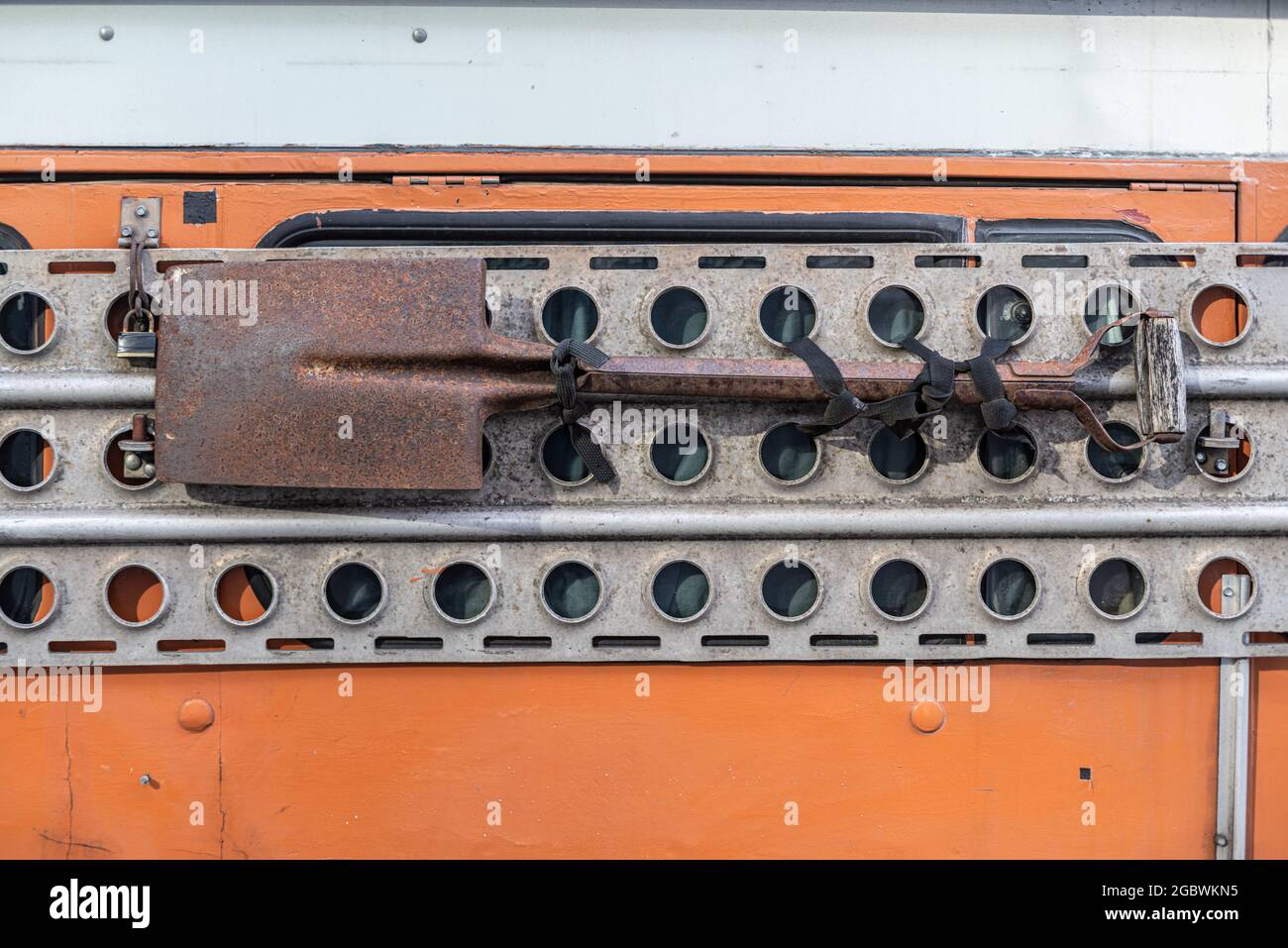 Old rusty shovel on perforated sheet metal Stock Photo - Alamy