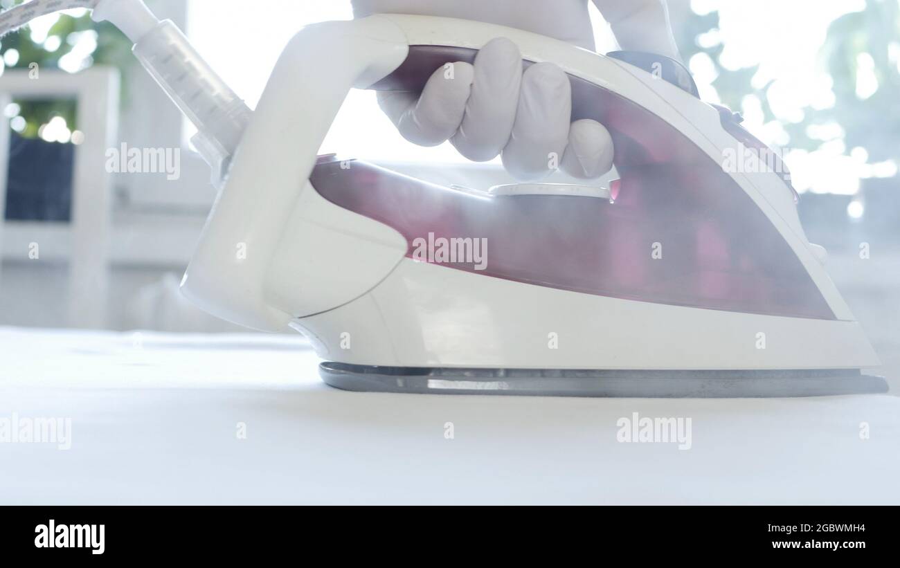 Steam iron shirt hi-res stock photography and images - Alamy