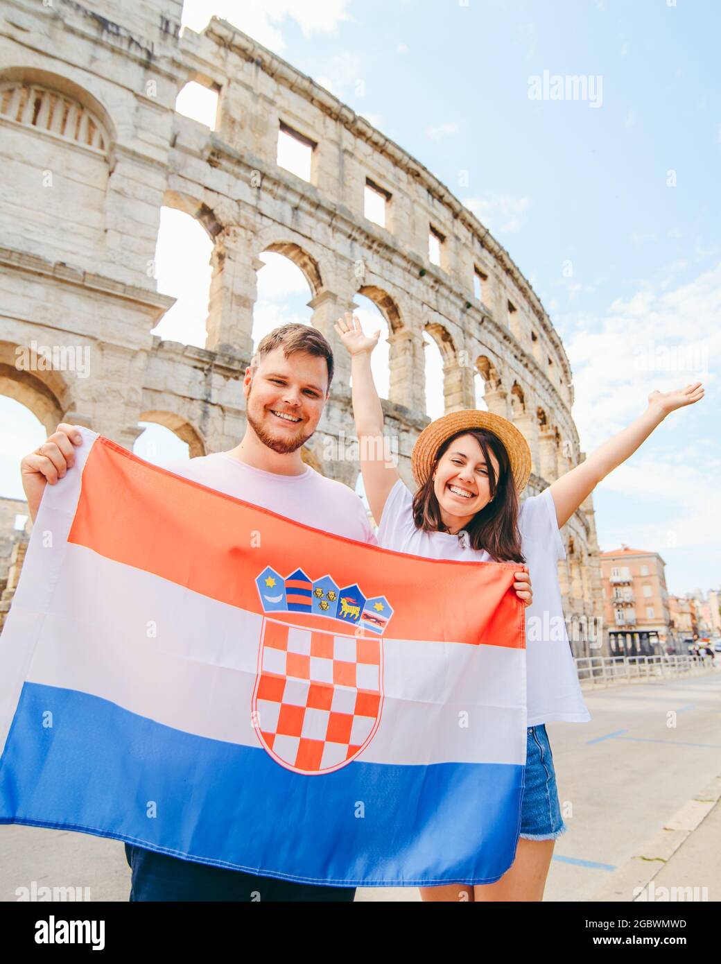 happy beautiful couple in front of coliseum in Pula Croatia with ...