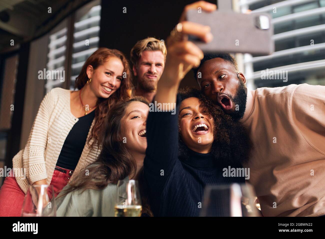 Friends pulling faces fun hi-res stock photography and images - Alamy