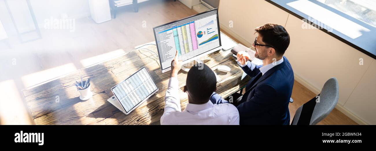 Spreadsheet Data On Computer Monitor In Office Stock Photo - Alamy