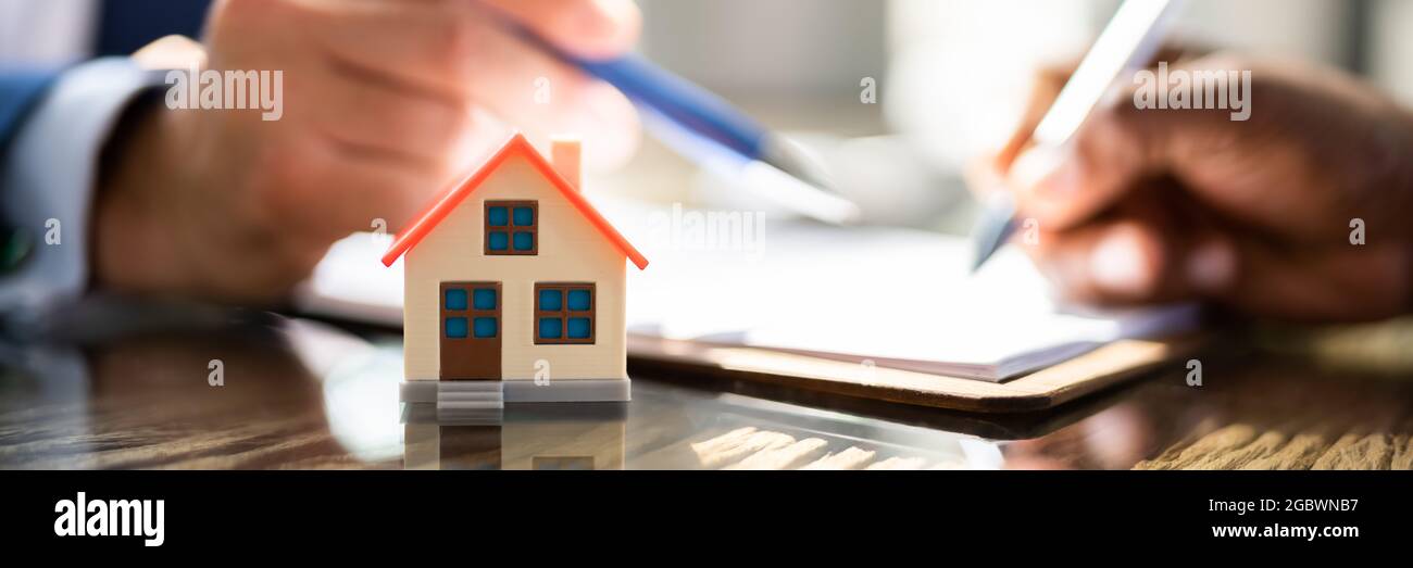 Signing Property Contract Paper. Real Estate Broker Stock Photo - Alamy