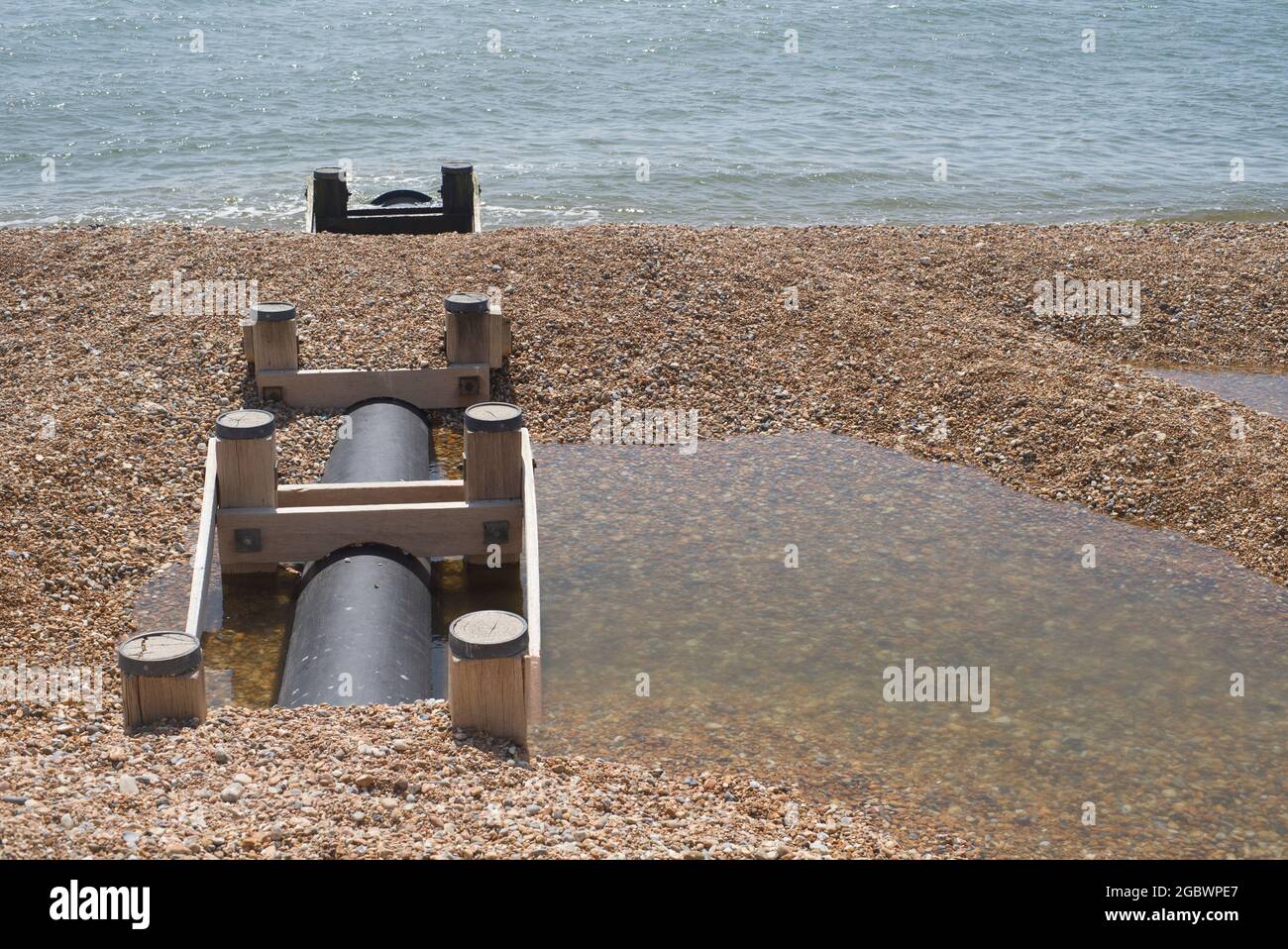 Beach drain pipe into the sea Stock Photo - Alamy