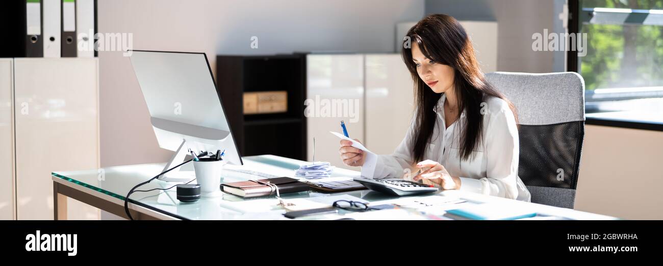 Accountant At Desk Using Finance Technology For Audit Stock Photo - Alamy