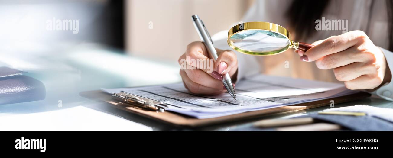 Corporate Auditor Using Magnifying Glass For Tax Fraud Audit Stock ...