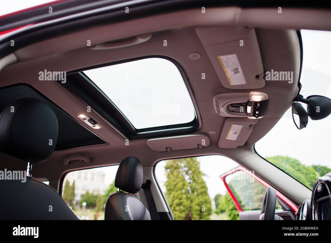 Interior of roof red city car. Small car for cities Stock Photo - Alamy