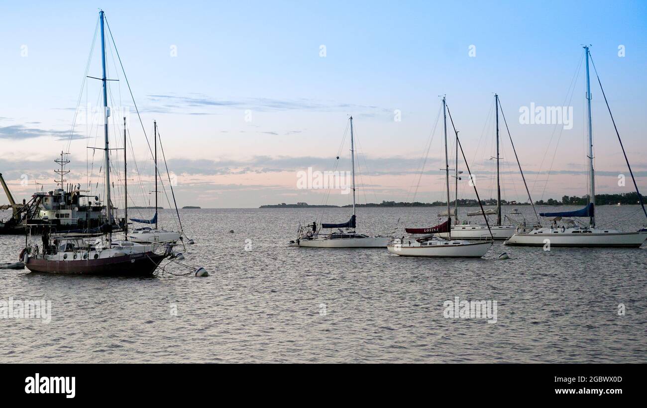 Beautiful scenery of boat sails without sail in the reflecting sea on ...