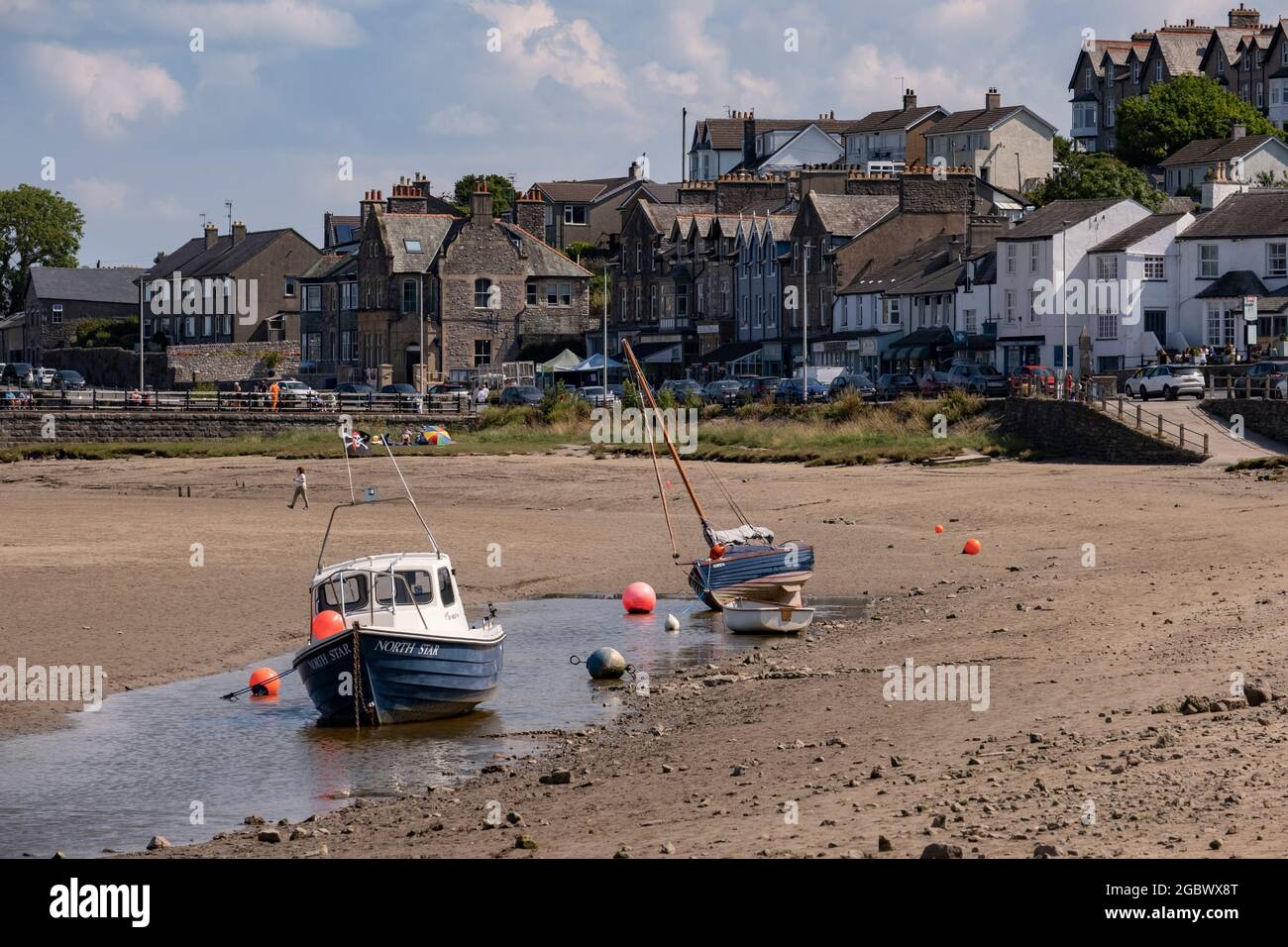 Low tide at Arnside in Lancashire, England with fishing boats high and ...