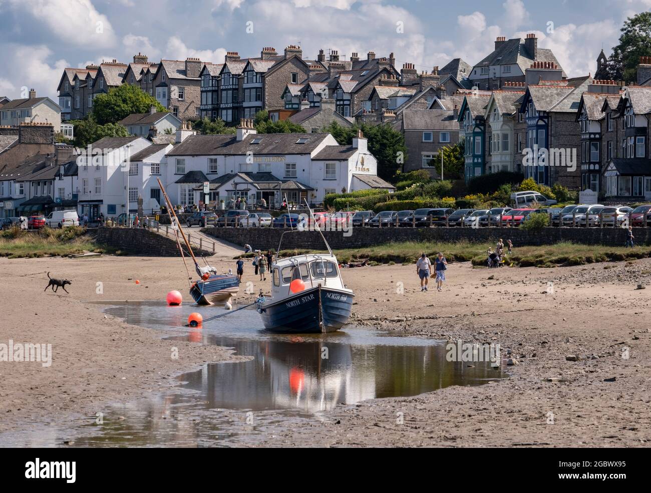Low tide at Arnside in Lancashire, England with fishing boats high and ...