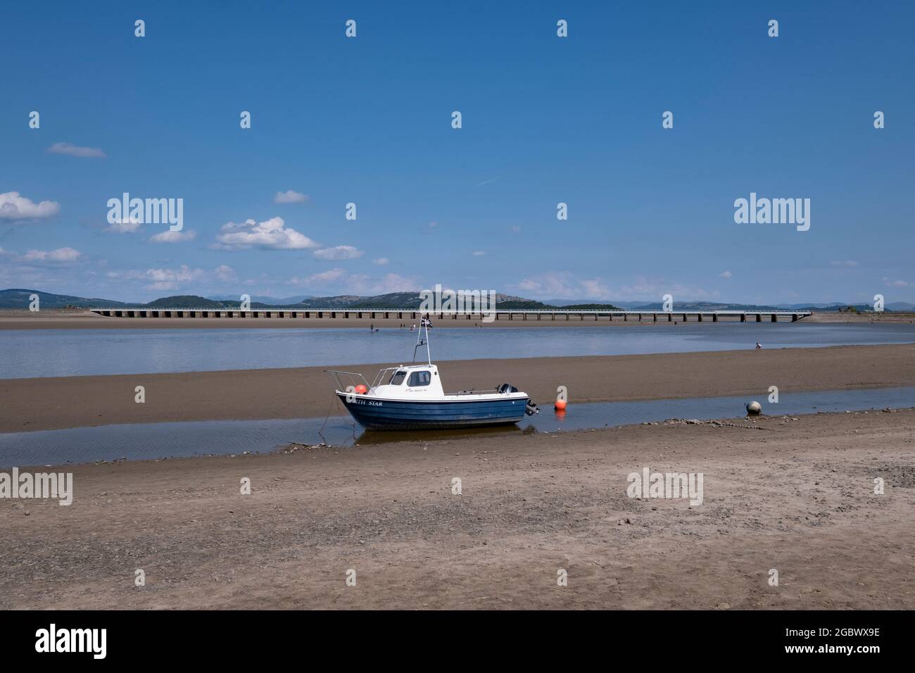 Low tide at Arnside in Lancashire, England with fishing boats high and ...