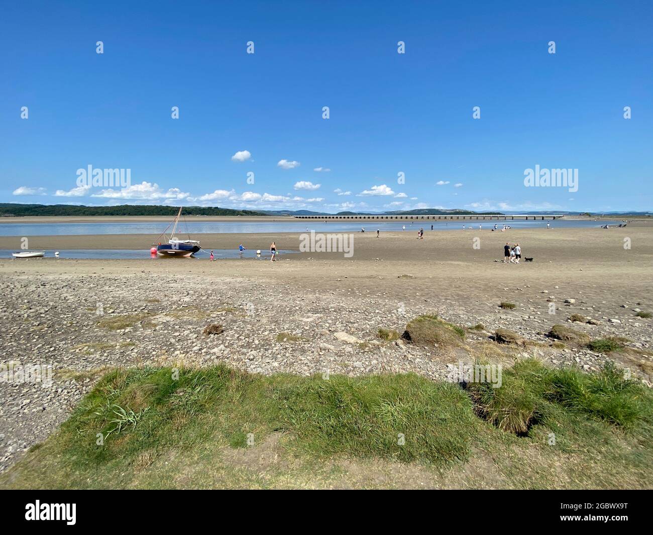 Low tide at Arnside in Lancashire, England with fishing boats high and ...