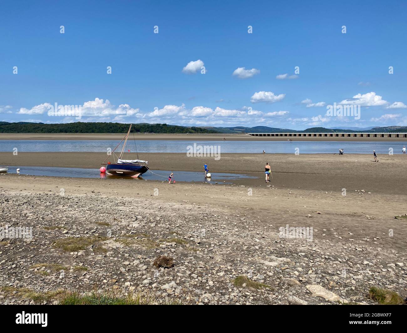 Low tide at Arnside in Lancashire, England with fishing boats high and ...