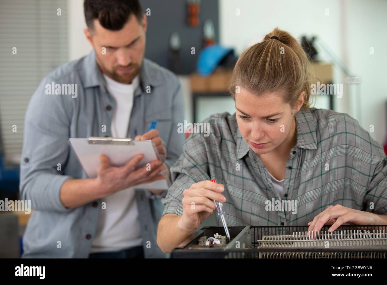 Carpentry apprentice shaving wood hi-res stock photography and images - Alamy