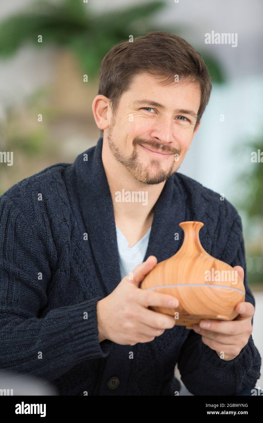 Holding diffuser hi-res stock photography and images - Alamy