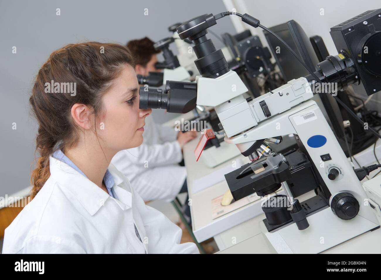 observing a particle under the microscopes Stock Photo - Alamy