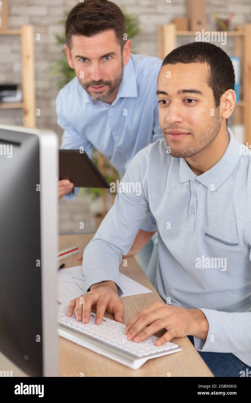 Young and old using it skills hi-res stock photography and images - Alamy