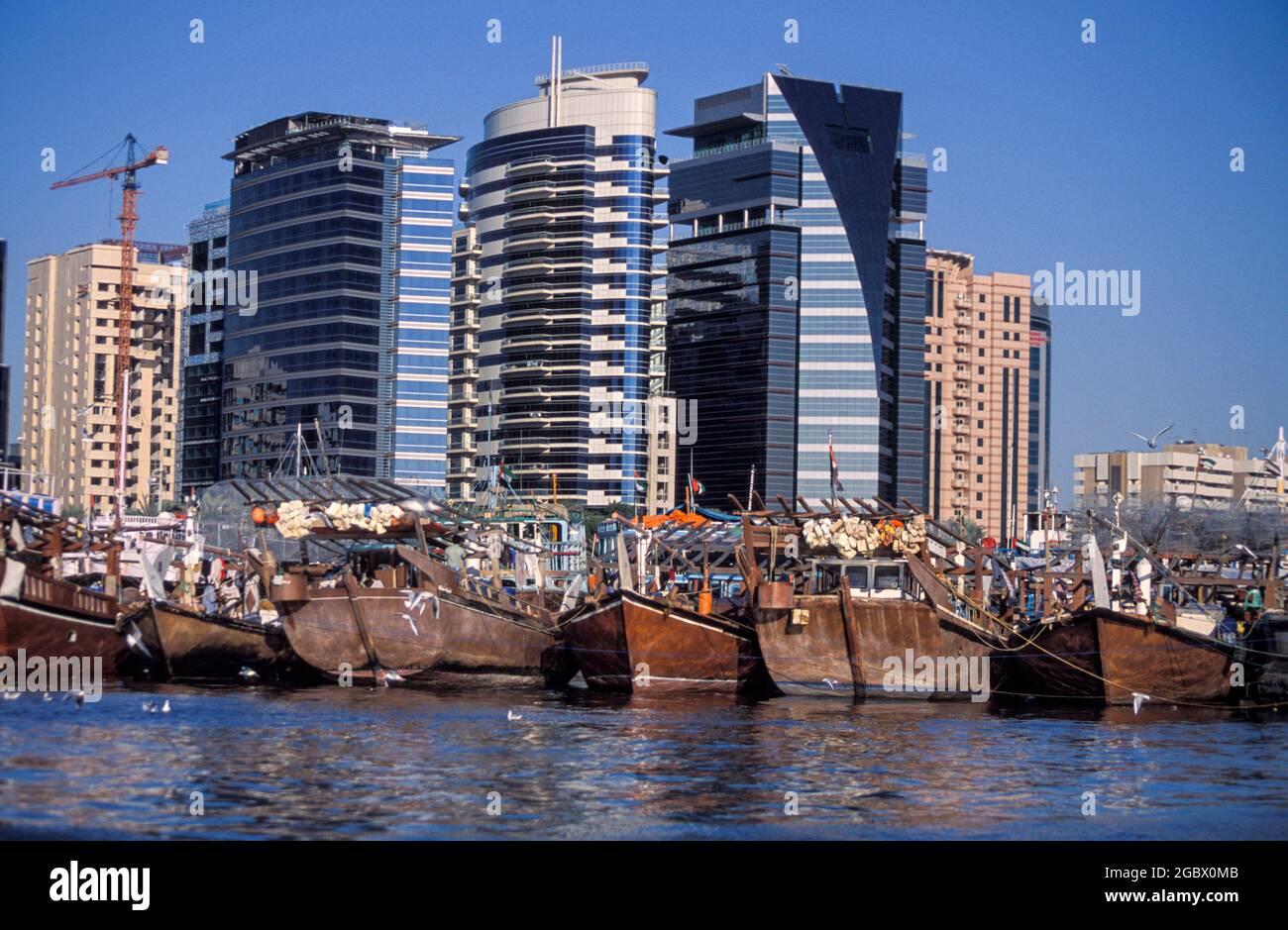 Row of cargo ships from an Abra boat ride across the Dubai Creek, Dubai ...