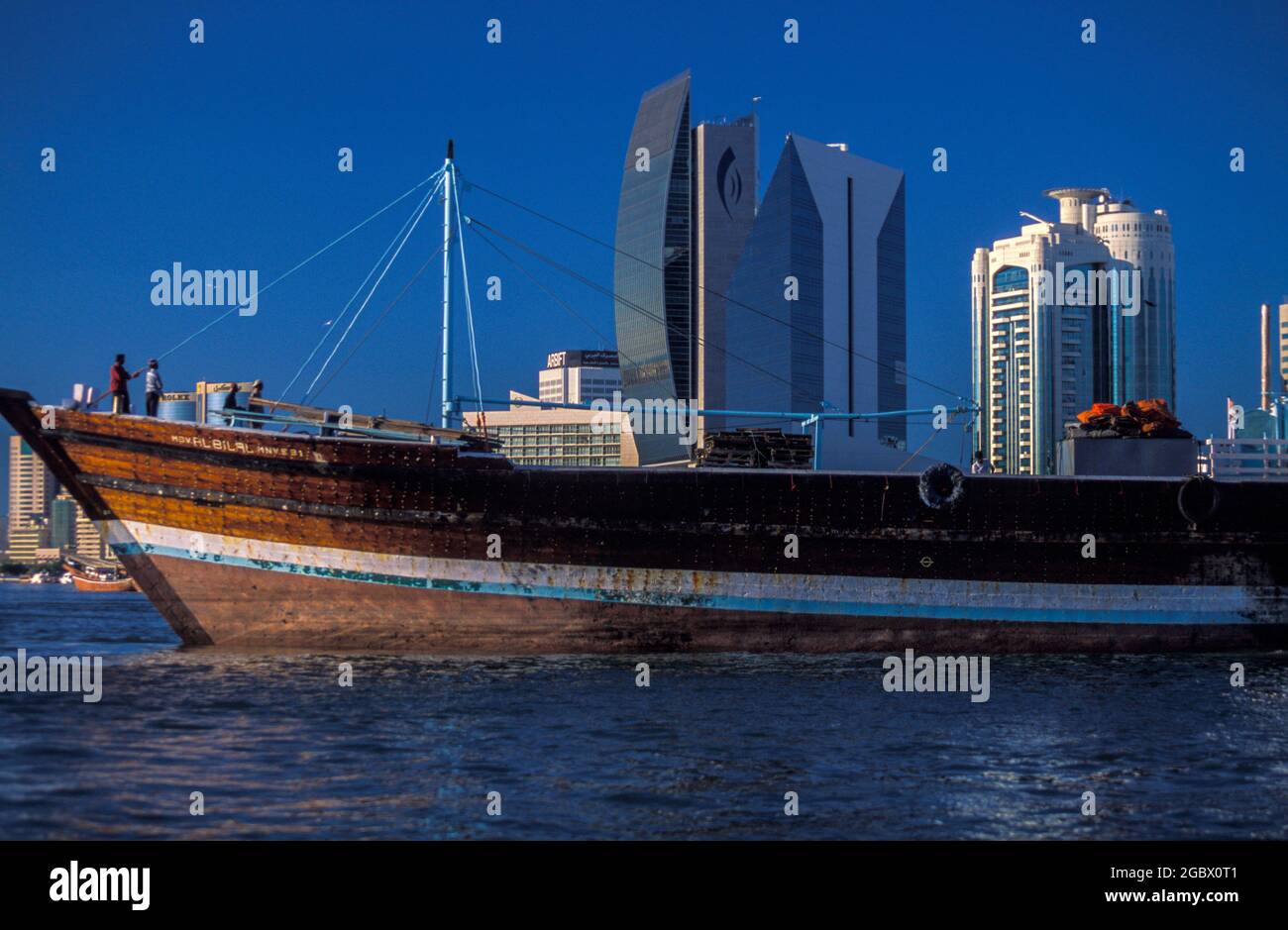 Cargo ship and Emirates NBD headquarters building in Deira, Abra boat ...