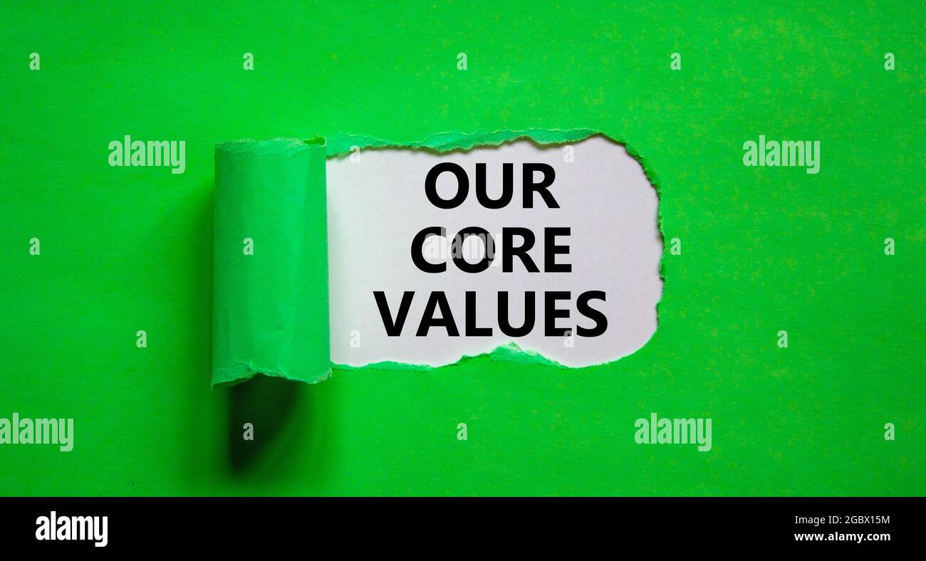 Our core values symbol. Words 'Our core values' appearing behind torn ...
