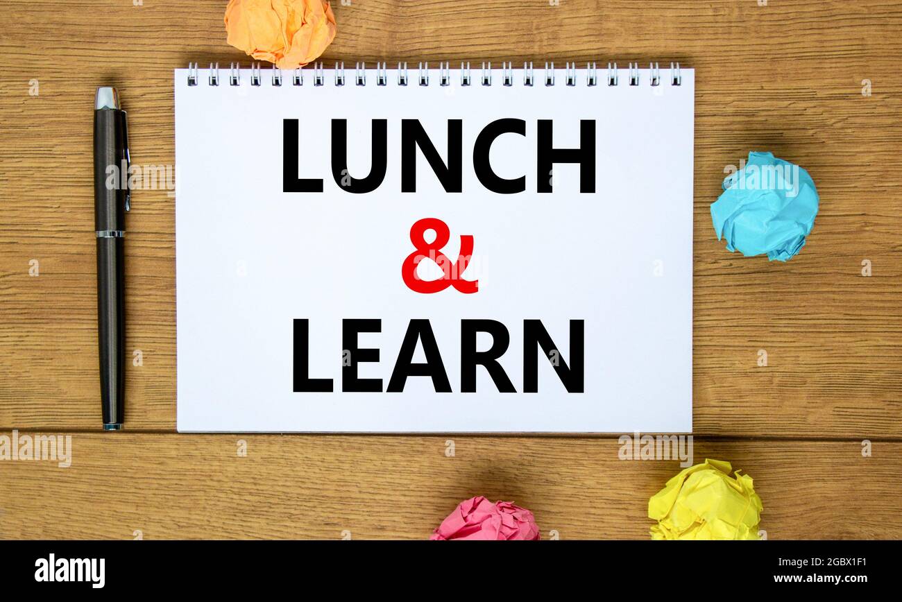 Lunch and learn symbol. Words 'Lunch and learn' on white note on ...