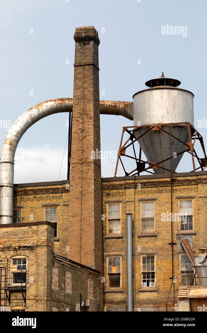 Factory Chimney and dust collection hopper Stock Photo - Alamy