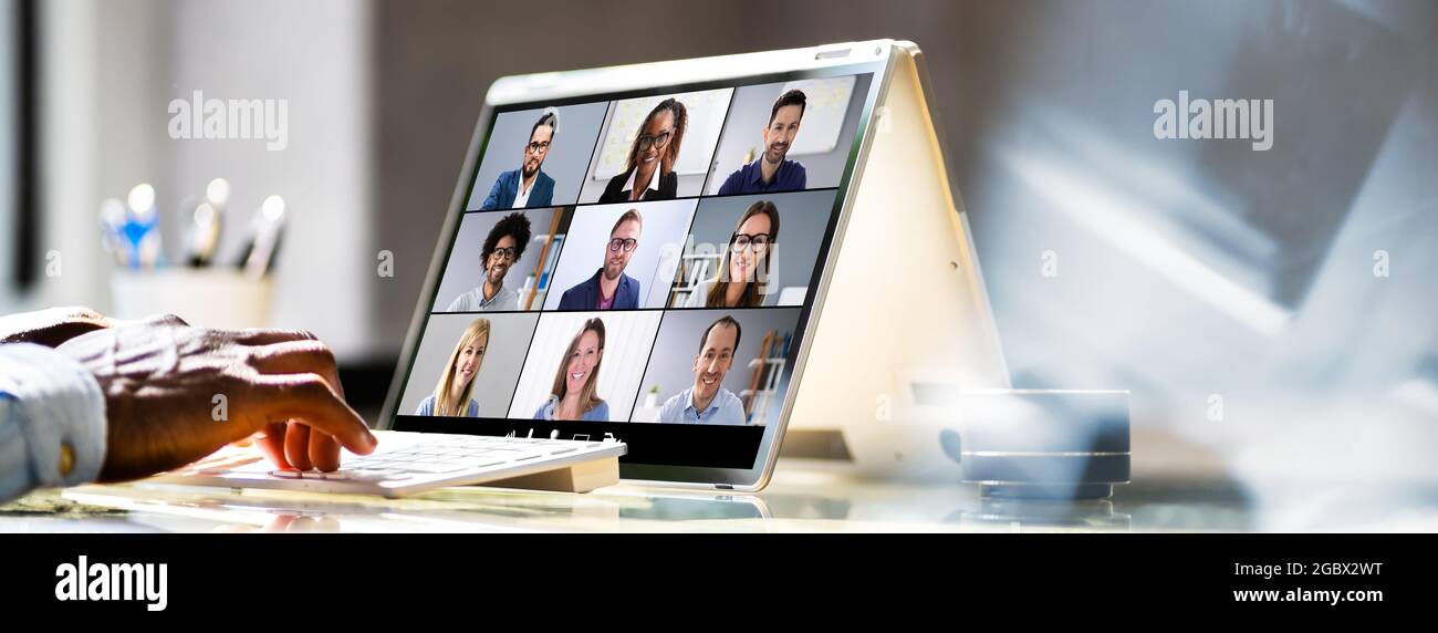 Video Conferencing In Office. African American Business Meeting Stock ...