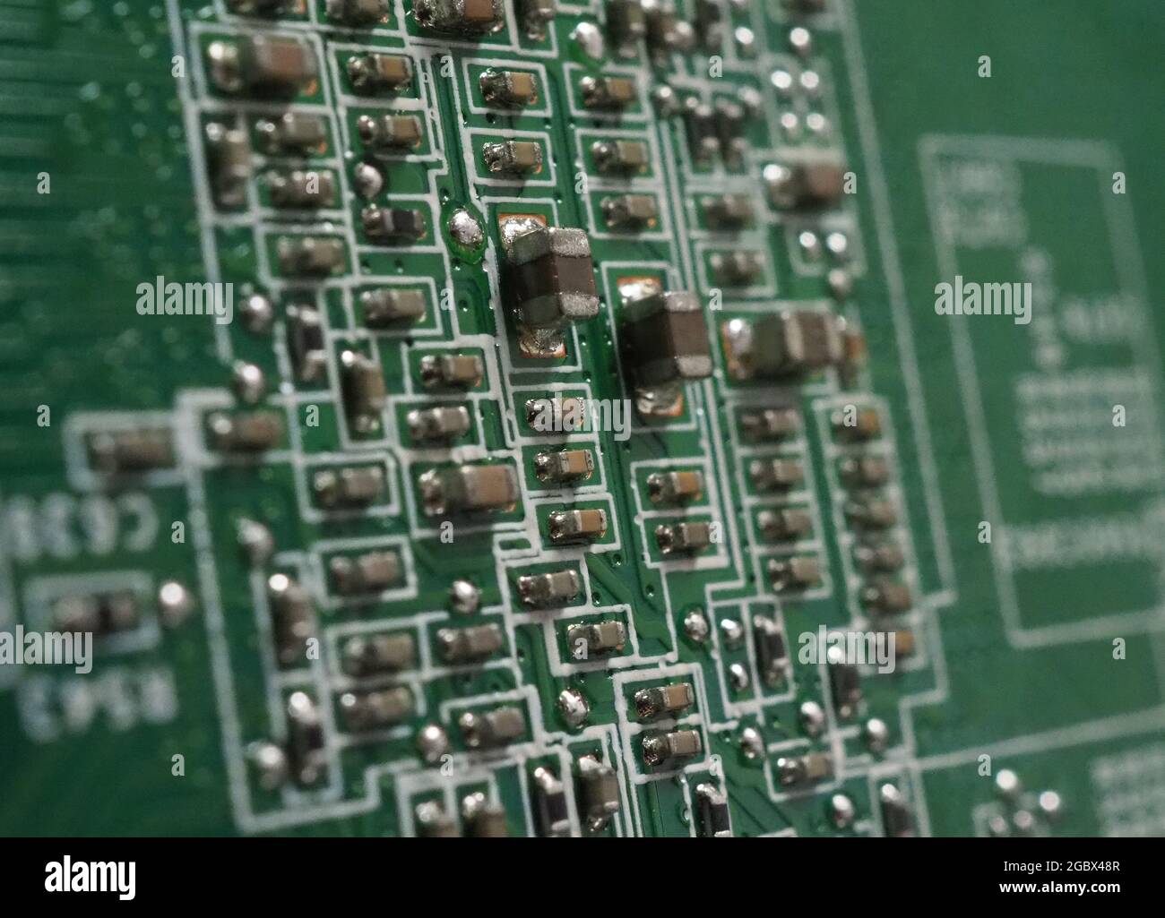 Semiconductor. cpu chip located on the green motherboard of the ...