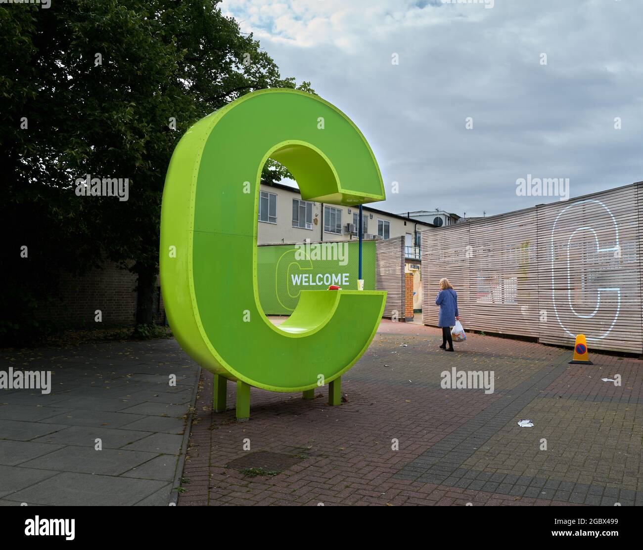 A female shopper at a welcome notice outside the shopping centre ...