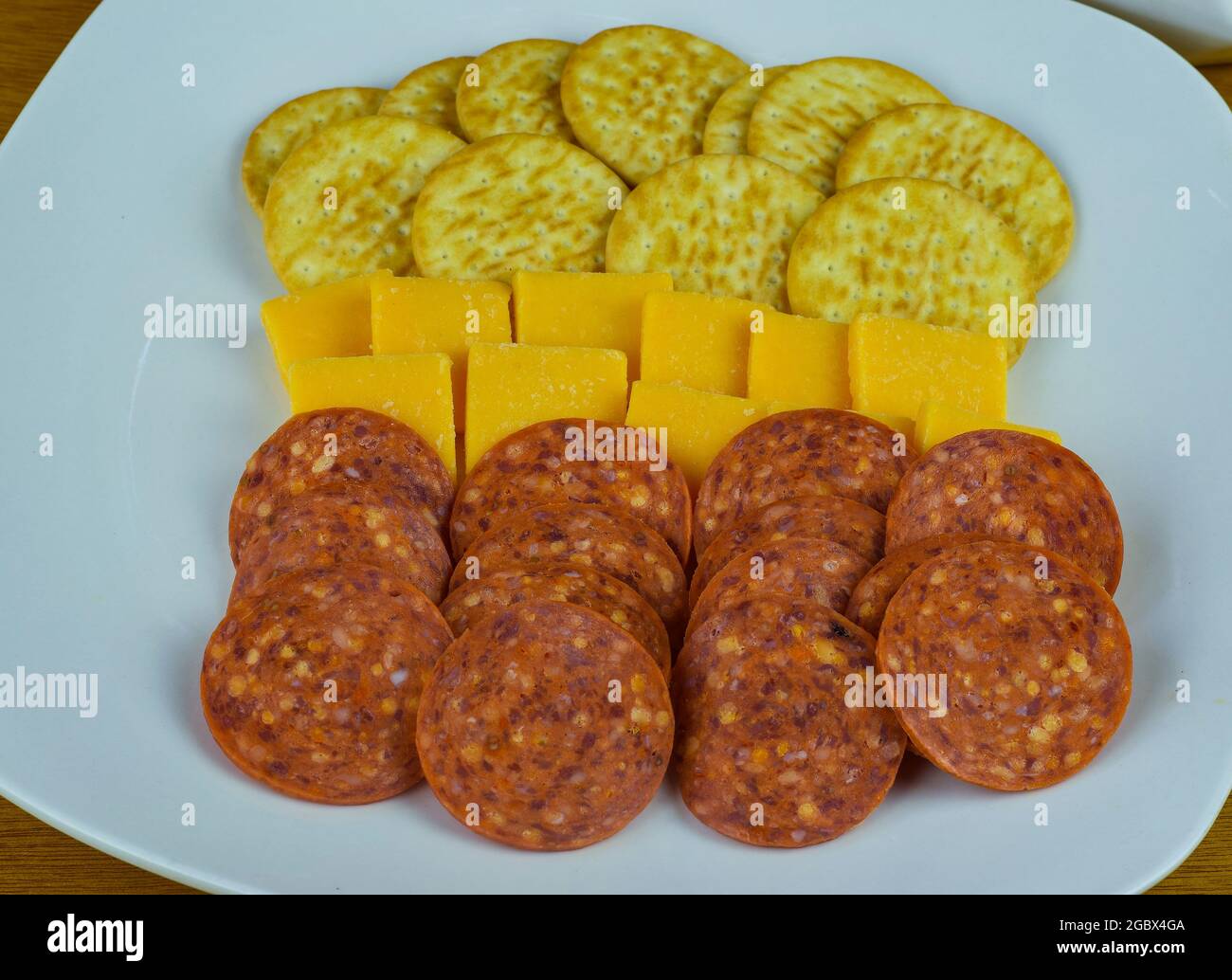 a snack plate consisting of crackers, cheeseand pepperoni Stock Photo ...