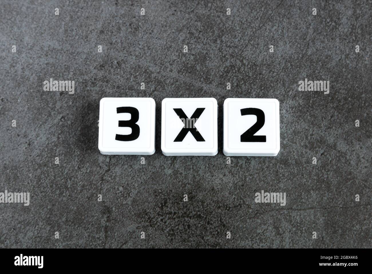 3x2 numbers on dark background Stock Photo - Alamy