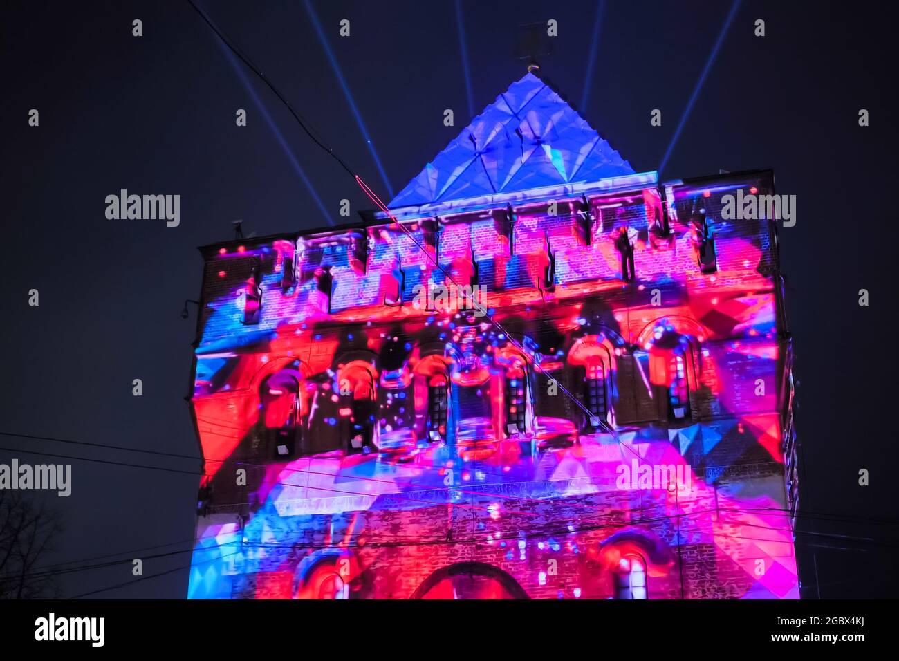 Colorful video mapping show projected on wall of historical building on ...