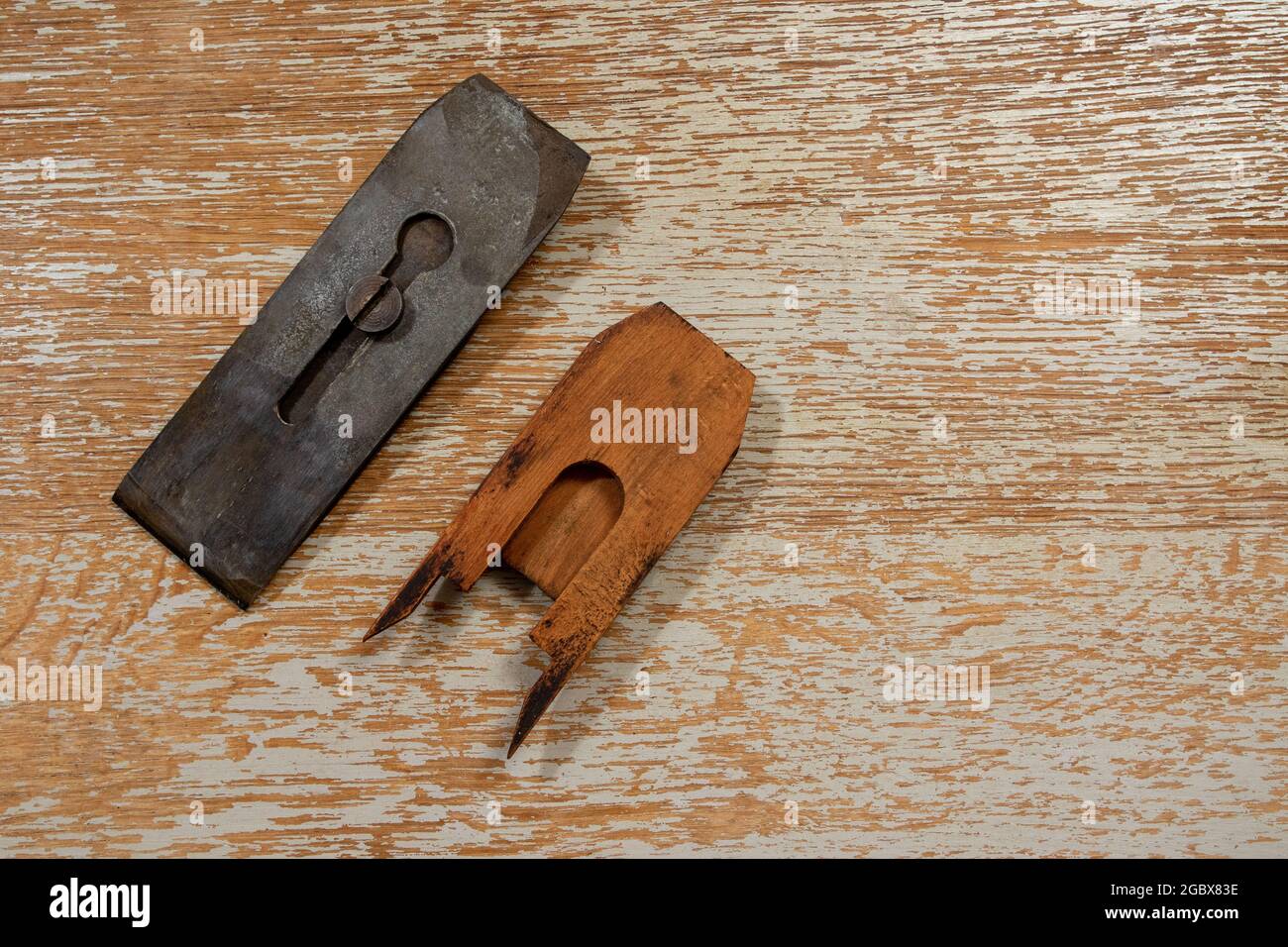 The blade and wedge from a large old school carpenter's wooden plane ...