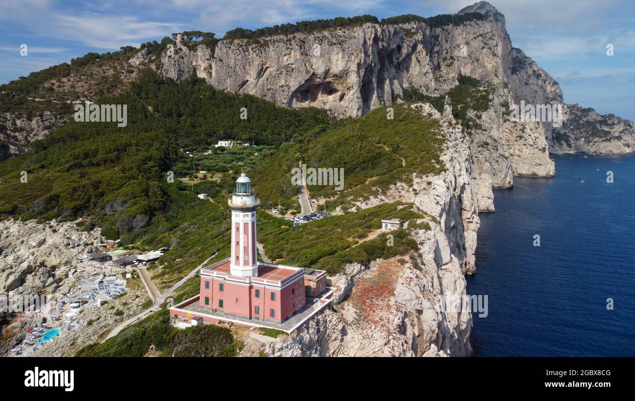 Lighthouse and Beach of Capri in summer season. View from a moving ...