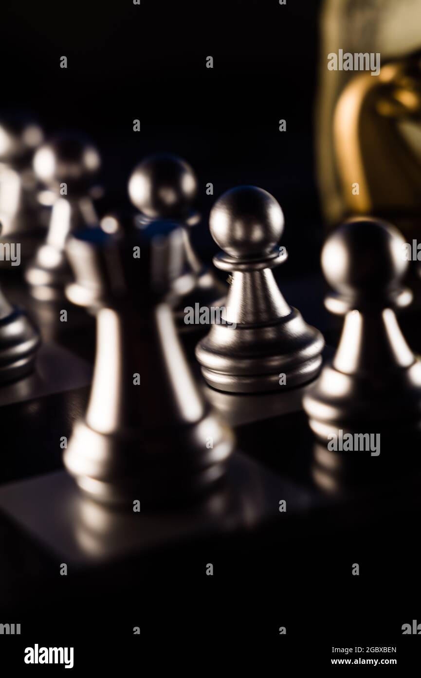 Vertical shot of silver chess pieces on a chessboard Stock Photo - Alamy