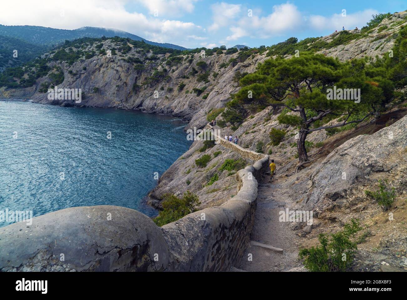 Tourists walk along the Golitsyn path .Crimea, the New World Stock ...