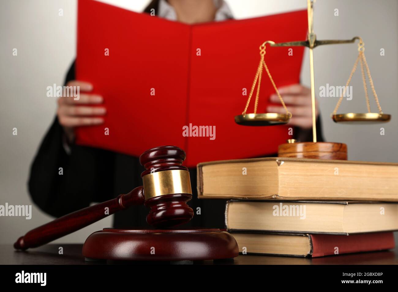 Judge read verdict on grey background Stock Photo - Alamy