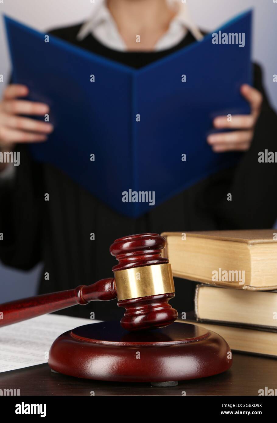 Judge read verdict on purple background Stock Photo - Alamy