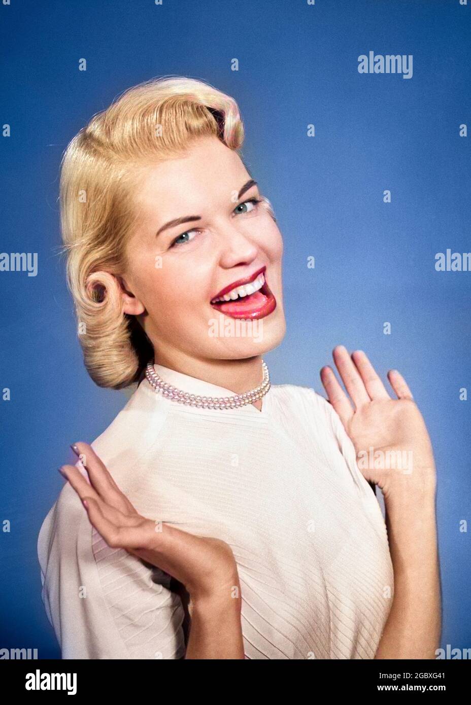 1950s HAPPY PROUD ELATED WOMAN WEARING PEARLS SMILING WITH HANDS UP ...